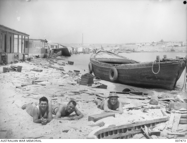 TOBRUK. SCENE ON THE LIBYAN RIVIERA. ON THE BEACH AT TOBRUK, ONCE THE ...