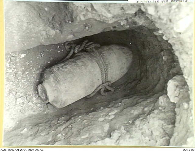 DIGGING OUT A 1000 POUND BOMB WHICH FAILED TO EXPLODE, FROM THE MAIN ...