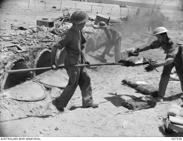 THE ARMY LIVES NOT ALONE ON 'HARD TACK' AND BULLY: HERE THE TOBRUK ...