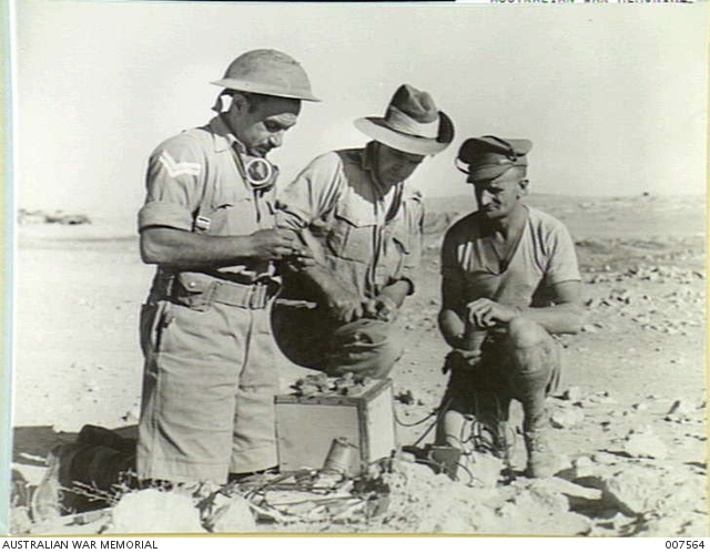 TOBRUK. PUTTING DETONATORS INTO CHARGES OF GELIGNITE THAT ARE TO BE ...