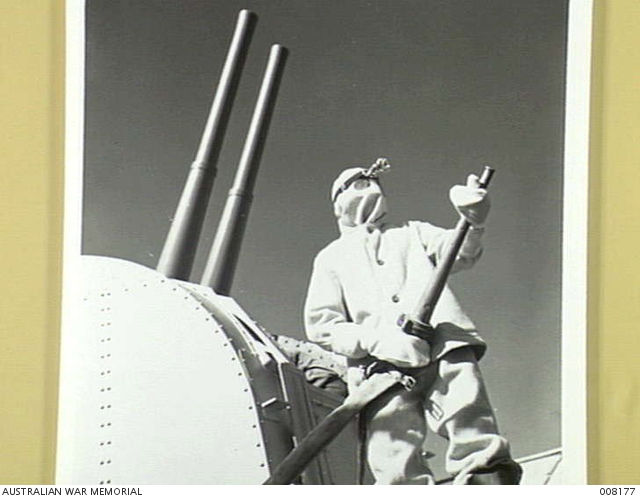 A member of the crew of the modified Leander class cruiser HMAS Perth ...