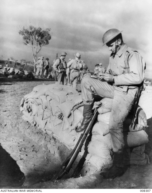 MAKING OF AN ANZAC - BILL DAVIS. RESTING DURING MANOEUVRES ...