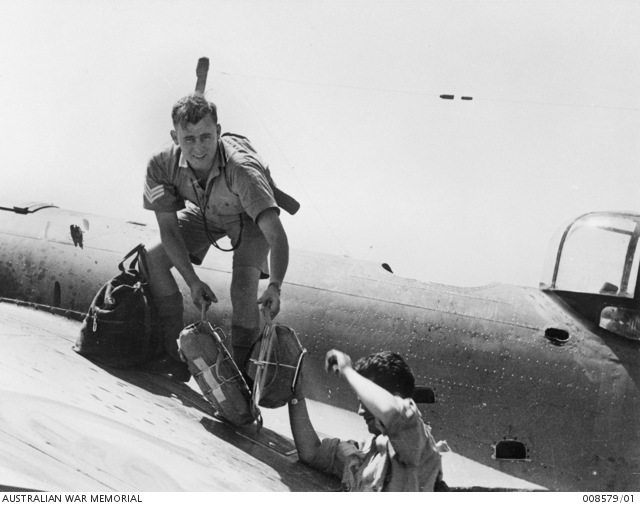 Syria. Crew members of a Blenheim aircraft getting ready to climb into ...