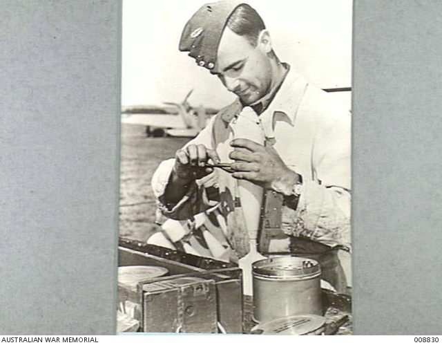 TRENTON, CANADA. PREPARING A SMOKE BOMB. JOB OF FILLING BOMBS IS DONE ...