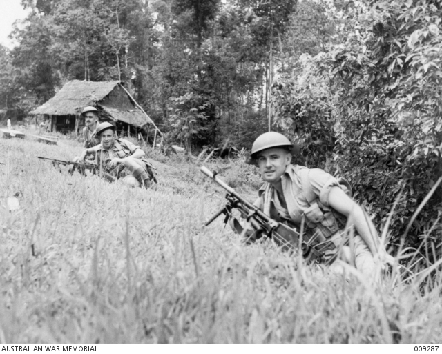 Malaya. Members of the AIF show an Australian Press Delegation (not ...