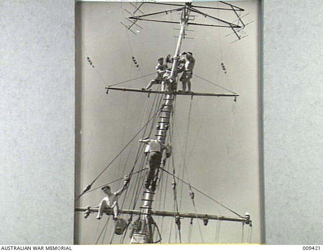 HMAS NIZAM. THE MASTS GETTING A NEW COAT OF PAINT. (NEGATIVE BY G. SILK ...