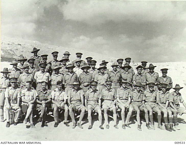 TOBRUK. AN OFFICIAL GROUP AT HQ 9TH DIVISION. FROM THE LEFT: FRONT ROW ...