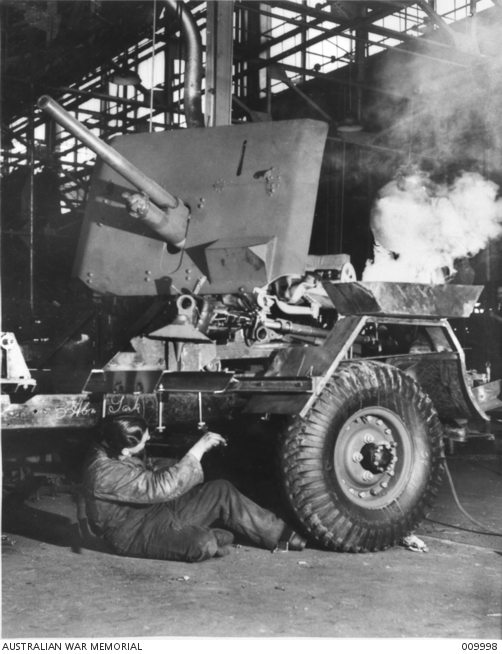 A 2 pounder anti-tank gun being manufactured at a factory somewhere in ...