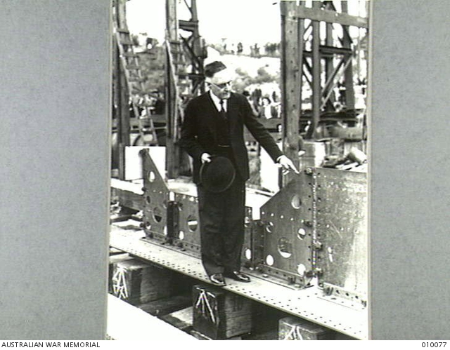 THE MINISTER FOR THE NAVY (MR. MAKIN) INSPECTS THE KEEL OF A NEW VESSEL ...