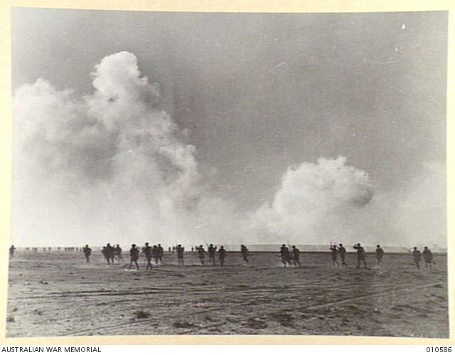 WESTERN DESERT. INFANTRY ADVANCING ACROSS THE DESERT. TROOPS PROTECT ...