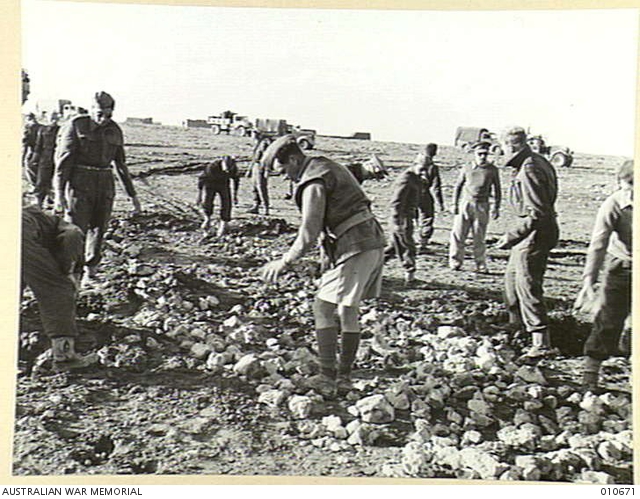 WITH TANKS, PLANES AND TRANSPORTS IN POSITION ON HIGH LAND IN LIBYA ...