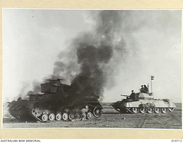 WESTERN DESERT. COMING ALONG SIDE TO INVESTIGATE IS A BRITISH TANK. THE ...