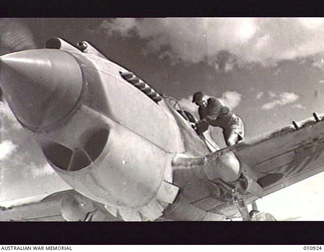 WESTERN DESERT. AN UNIDENTIFIED PILOT OF NO. 3 SQUADRON RAAF CLIMBING ...