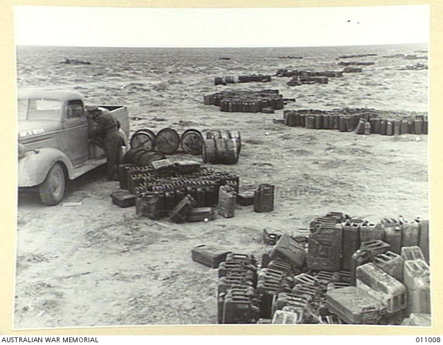 A GERMAN PETROL DUMP CAPTURED DURING THE 8TH ARMY'S ADVANCE IN LIBYA ...