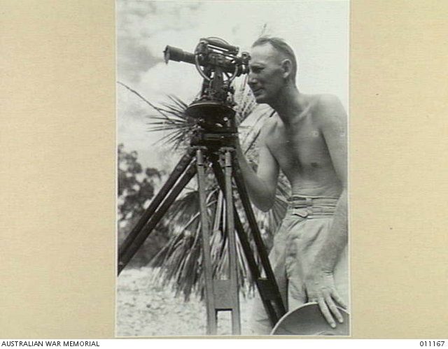 DARWIN. AN ARMY SURVEYOR AT WORK ON ONE OF DARWIN'S NEW ROADS ...