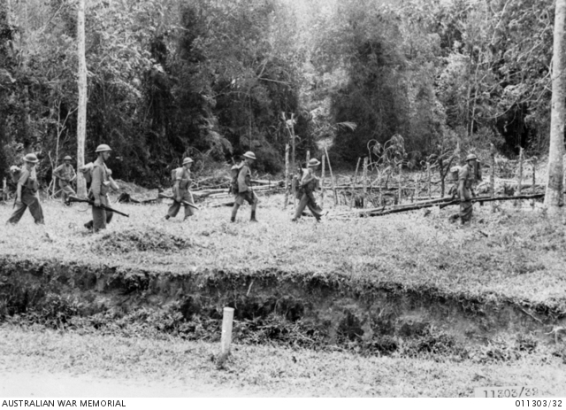 Malaya. AIF troops on a forward patrol searching for the enemy on the ...