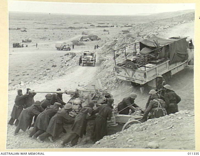 WESTERN DESERT. TOUGH GOING -- BOFORS CREW DESCEND FROM LORRY AND "MAN ...