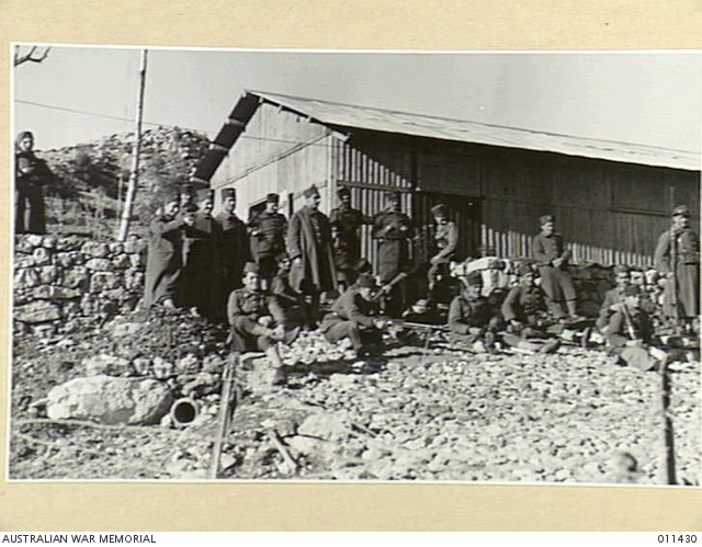 AUSTRALIAN TROOPS SHOW FREE FRENCH VISITORS THE VIEW FROM ONE OF THEIR ...
