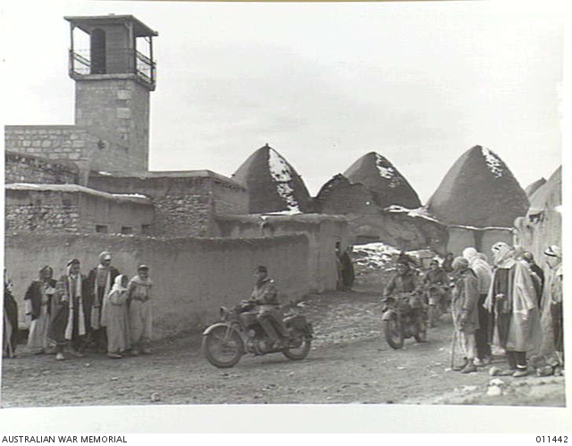 SYRIA. AUSTRALIAN MOTOR-BIKE PATROL ENTERING A VILLAGE ON A FRIENDLY ...