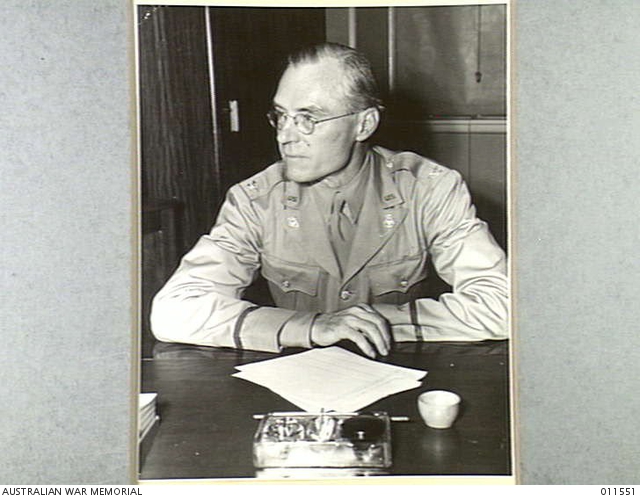 COLONEL VAN S. MERLE-SMITH, US MILITARY ATTACHE, AT HIS DESK ...