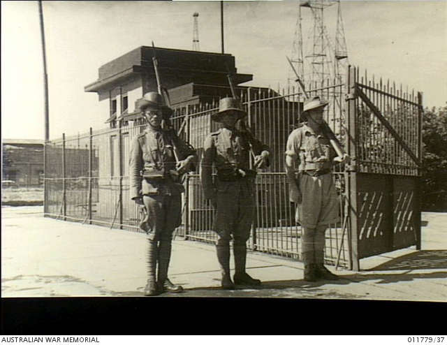 AN AUSTRALIAN SOLDIER STANDING GUARD WITH MEMBERS OF THE NETHERLANDS ...