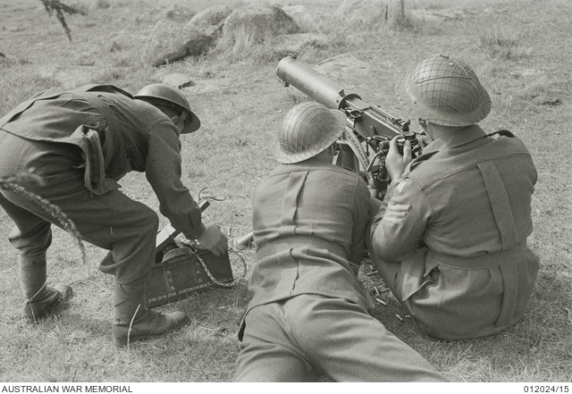 Machine gun crews of the 4th Motor Regiment go into action in double ...