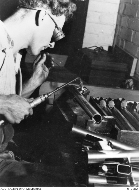 SIMPLICITY IS THE KEYNOTE OF THE OWEN GUN. AN ACETYLENE WELDER ATTACHES ...