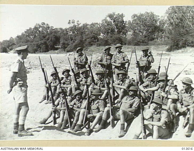A PLATOON COMMANDER WITH HIS TROOPS AT A FORWARD BATTLE STATION IN ...