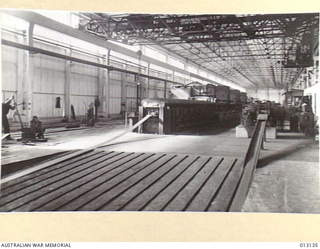 IN THIS PICTURE, THE SKELP IS SHOWN LEAVING THE BUTT WELDING MACHINE ON ...