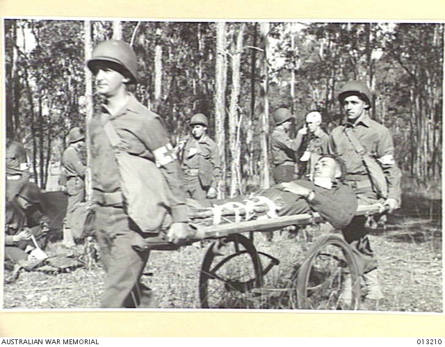 FIRST-AID UNITS, OPERATING CLOSELY BEHIND THE FRONT LINE, COLLECT THE ...