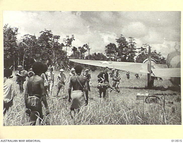 AIR-BORNE AUSTRALIAN AND AMERICAN TROOPS ARRIVE AT A JUNGLE LANDING ...