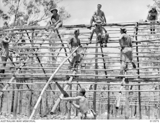NORTHERN TERRITORY. AUSTRALIAN TROOPS USING ABORIGINAL BUILDING ...