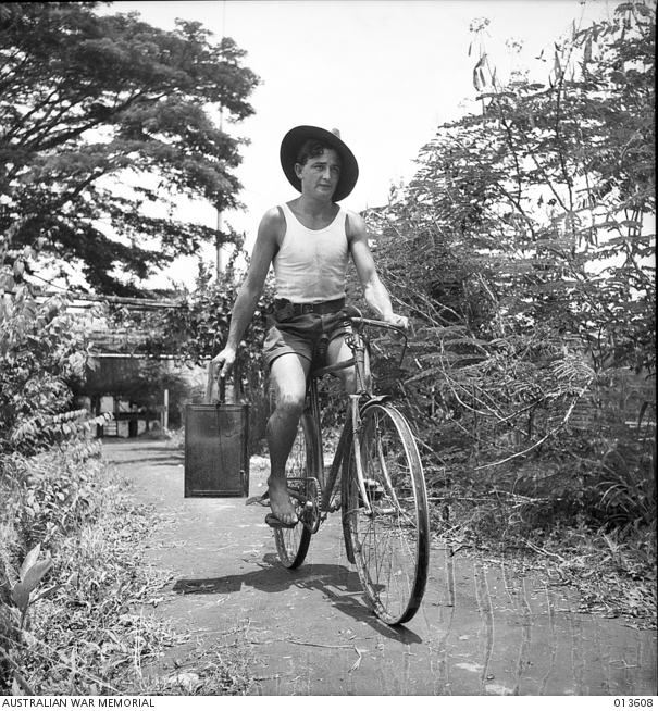 NEW GUINEA. KOKODA. PRIVATE R.S. BRETT (N.S.W.) COOKS FOR SOME OF THE ...