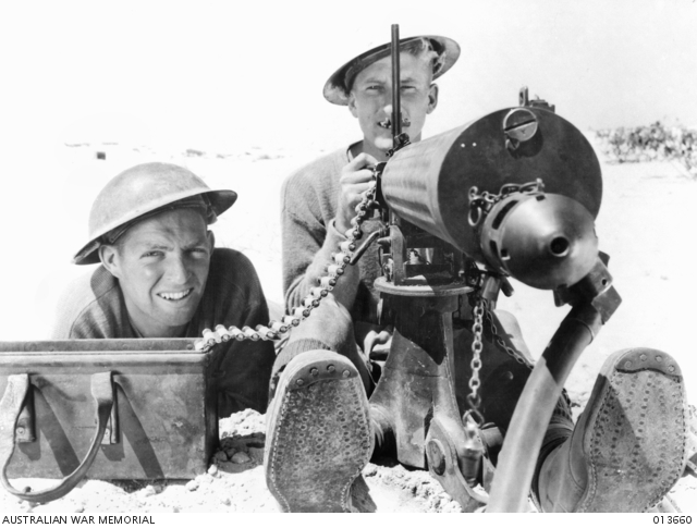 STUDY OF A MACHINE GUN AND CREW IN THE WESTERN DESERT. THIS PICTURE WAS ...