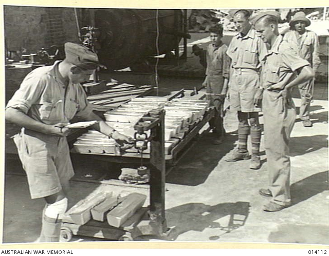 WEIGHING INGOTS OF ALUMINIUM MELTED DOWN FROM CRASHED AIRCRAFT AT ABBASSIA, CAIRO. (NEGATIVE BY ...