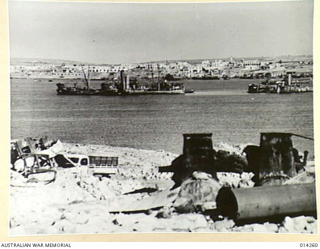 TOBRUK FROM THE SOUTH. FROM THIS ANGLE THE BUILDINGS LOOK INTACT, BUT ...