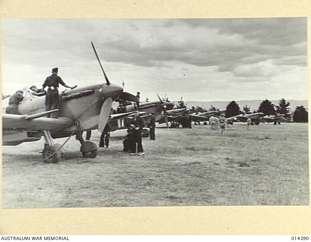 SPITFIRE SQUADRONS IN AUSTRALIA. THESE PLANES ARE MANNED BY R.A.F. AND ...