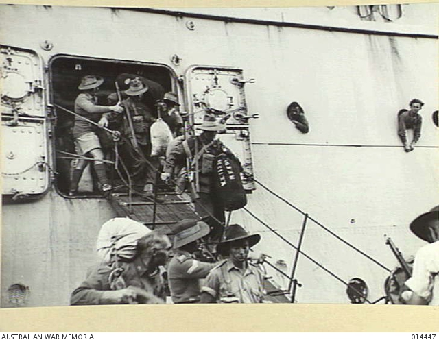 SOLDIERS DISEMBARKING FROM A TROOP TRANSPORT SHIP ON THEIR RETURN HOME ...
