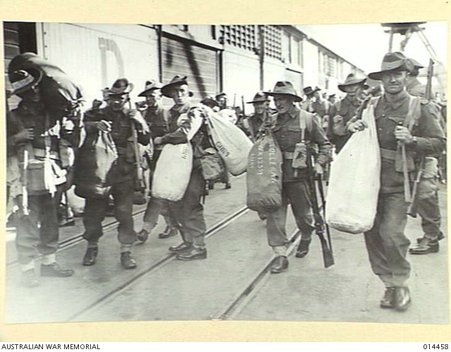 SOLDIERS DISEMBARKING FROM A TROOP TRANSPORT SHIP ON THEIR RETURN HOME ...