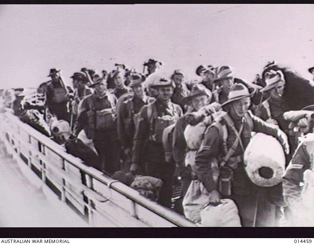 SOLDIERS DISEMBARKING FROM A TROOP TRANSPORT SHIP ON THEIR RETURN HOME ...