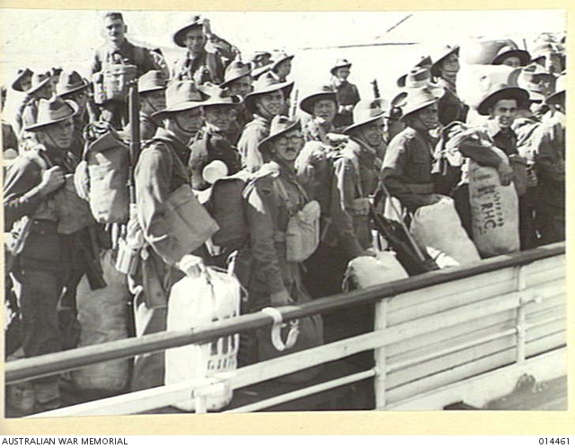 SOLDIERS DISEMBARKING FROM A TROOP TRANSPORT SHIP ON THEIR RETURN HOME ...
