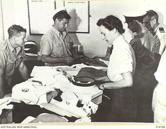 NAVAL DEPOT. PHOTO TAKEN IN CLOTHING STORE SHOWS "SLOPS" BEING ISSUED ...