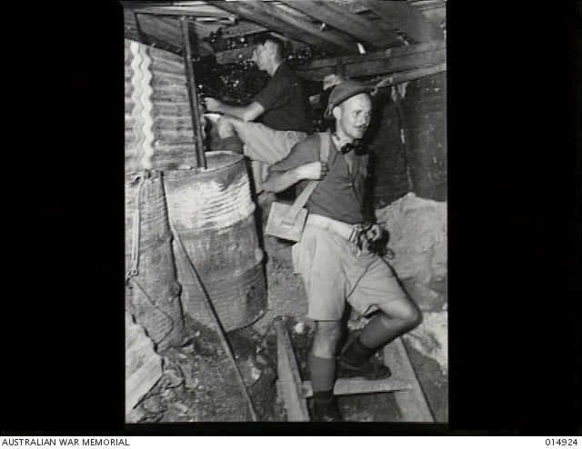 Australian Army Signaller R. A. Roberts from Cammeray, NSW, enters an ...