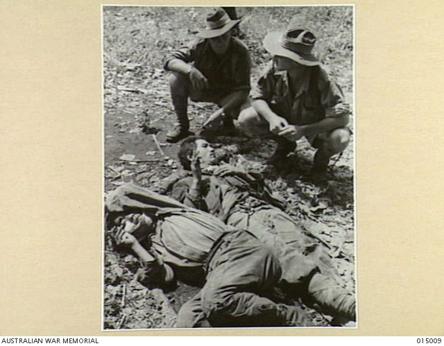 NEW GUINEA. JAPANESE WOUNDED IN NEW GUINEA WAITING TO BE TAKEN TO AN ...