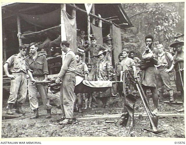 NEW GUINEA. MOUNT TAMBU. A WOUNDED AMERICAN SOLDIER BEING CARRIED FROM ...