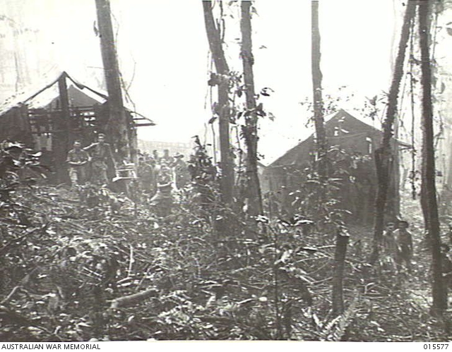 NEW GUINEA. MOUNT TAMBU. AUSTRALIANS CLEARING THE JUNGLE ROUND HOUSE ...