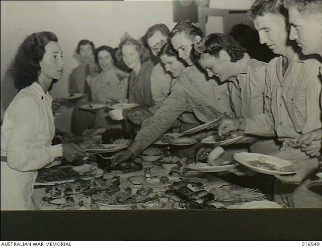 New Guinea. Guests and partners being served buffet style food by an ...