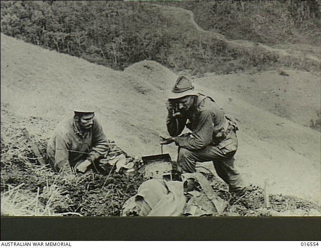 New Guinea. Two Army signallers communicating with their Headquarters ...