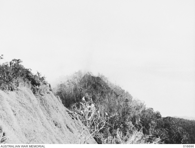 New Guinea. Shells bursting on the Pimple at Shaggy Ridge. A shot from ...