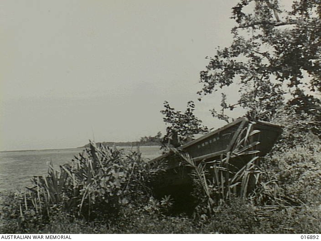 New Britain. This strafed unserviceable Japanese barge was left behind ...